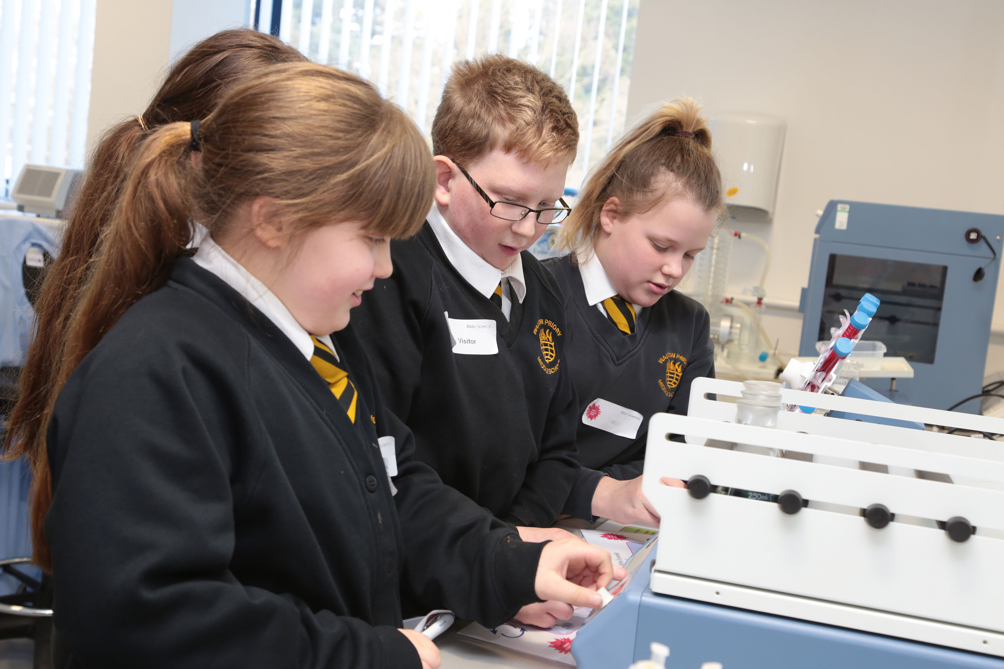 Children experiment in real lab during British Science Week ...